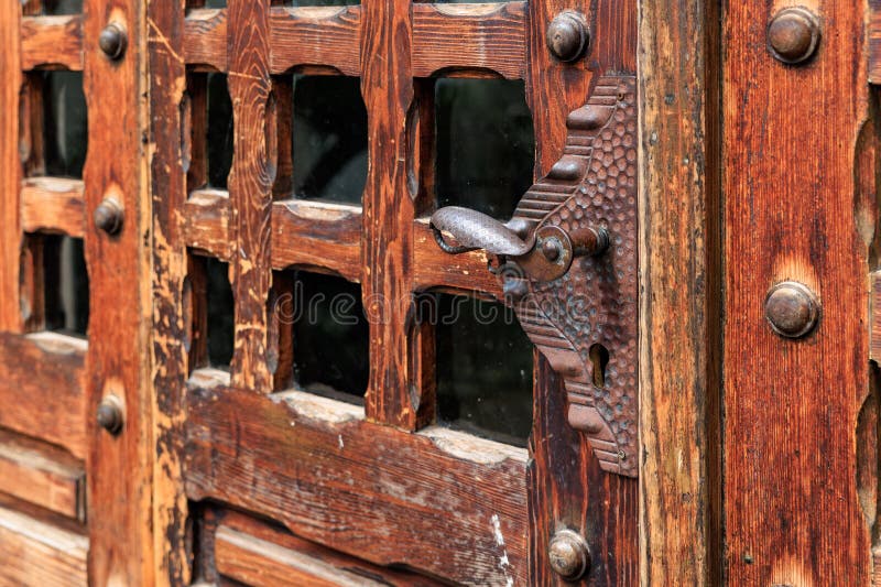 Rustic Wooden Door with Wrought Iron Handle and Latch Design Stock ...