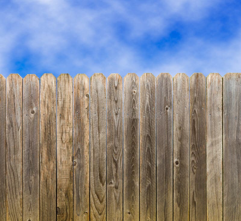 Rustic Wooden Privacy Fence with Blue Sky and Clouds Stock Image ...