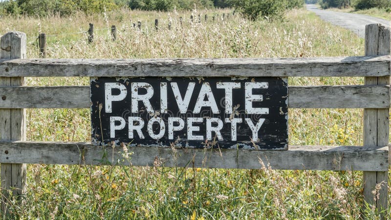 Rustic Wooden Fence with Private Property Sign in a Field Stock ...