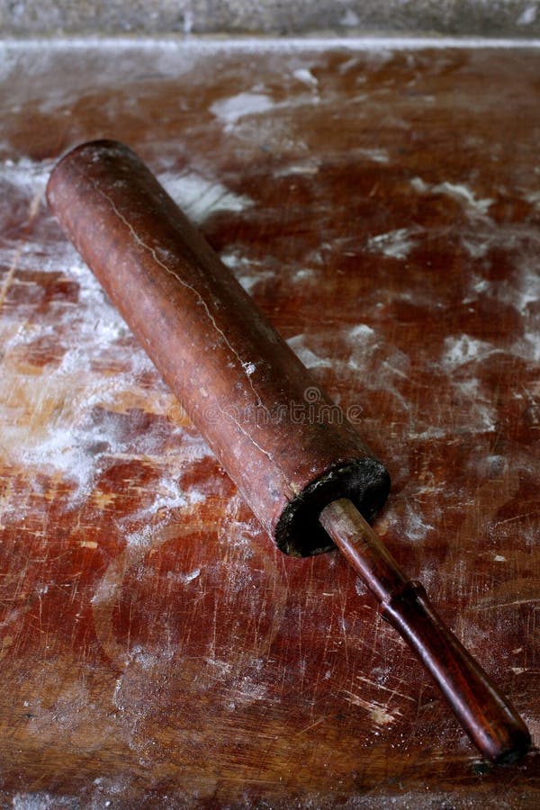 Rustic Wooden Rolling Pin Rests Diagonally on a Flour-dusted Surface ...