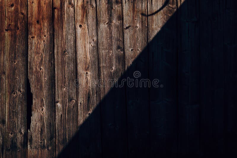 Rustic Wooden Shed Wall with Diagonal Shadow Forming Intricate Pattern ...