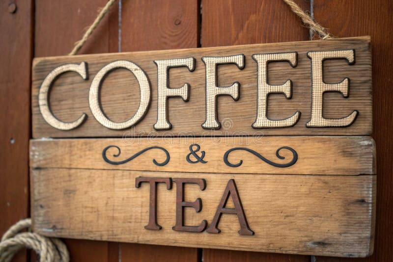 Rustic Wooden Sign with Carved Letters Indicating a Coffee & Tea ...