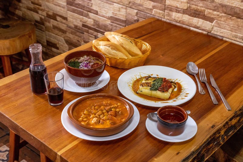 Rustic Wooden Table Displaying a Selection of Delicious Dinner Food on ...