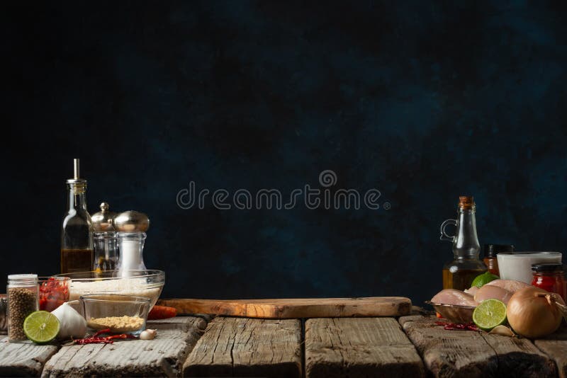 Rustic Wooden Table with Ingredients for Cooking Meal on Dark Blue ...