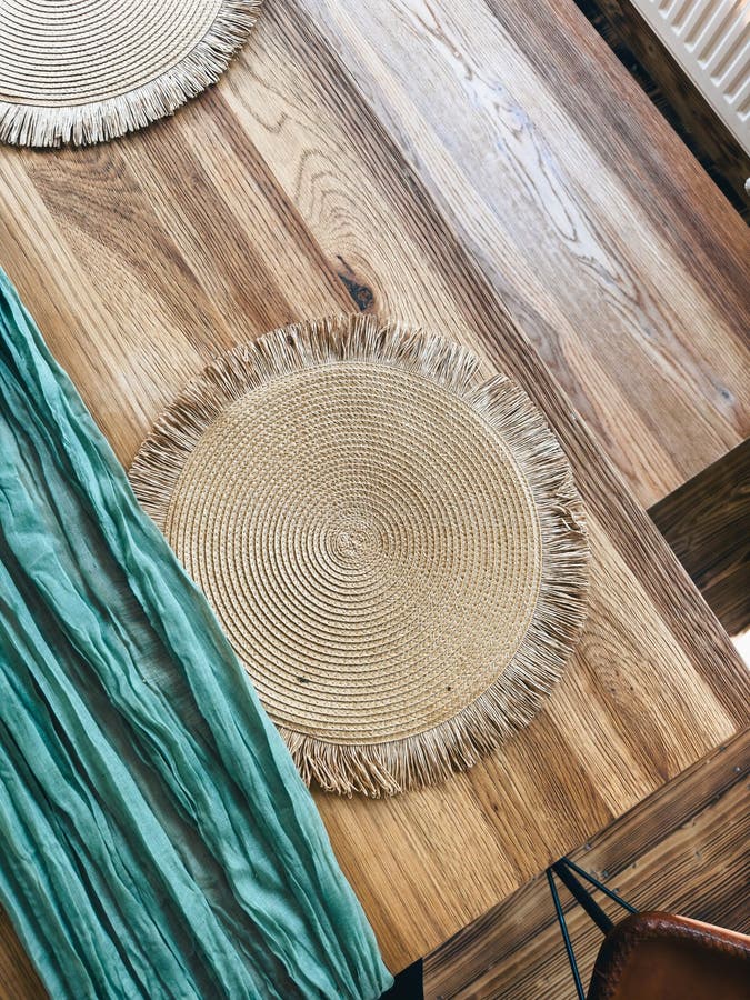 Rustic Wooden Table with Woven Placemats and a Green Cloth. Stock Photo ...