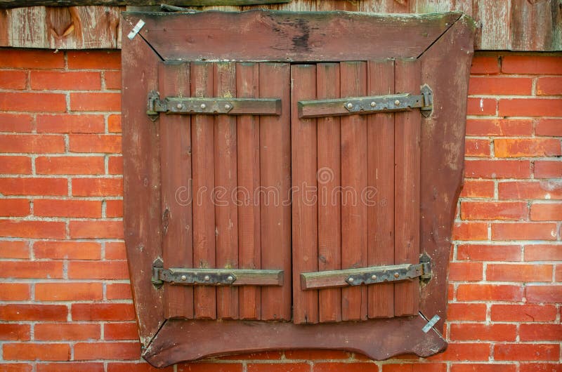 Rustic Wooden Window with Closed Shutters on Redbricks Wall Stock Image ...