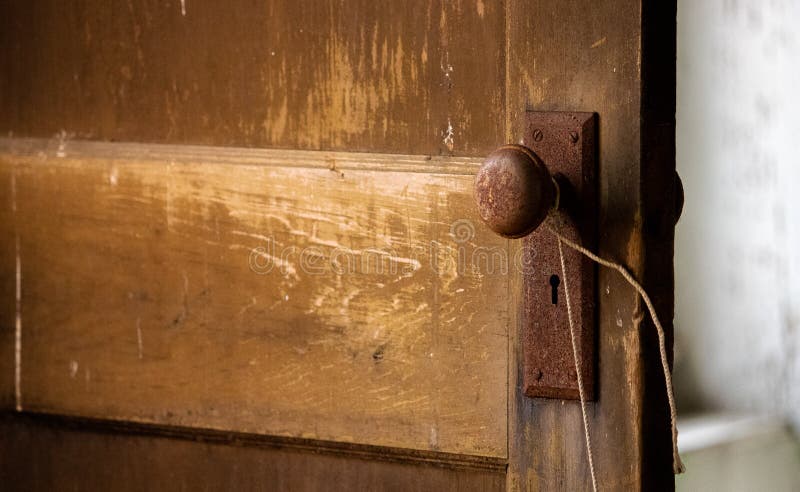 A Rusting Door Handle Sits with String Attached Stock Image - Image of ...