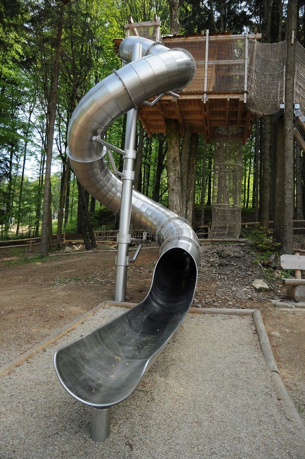 Stainless Steel Spiral Slide in Forest Adventure Playground Stock Photo ...