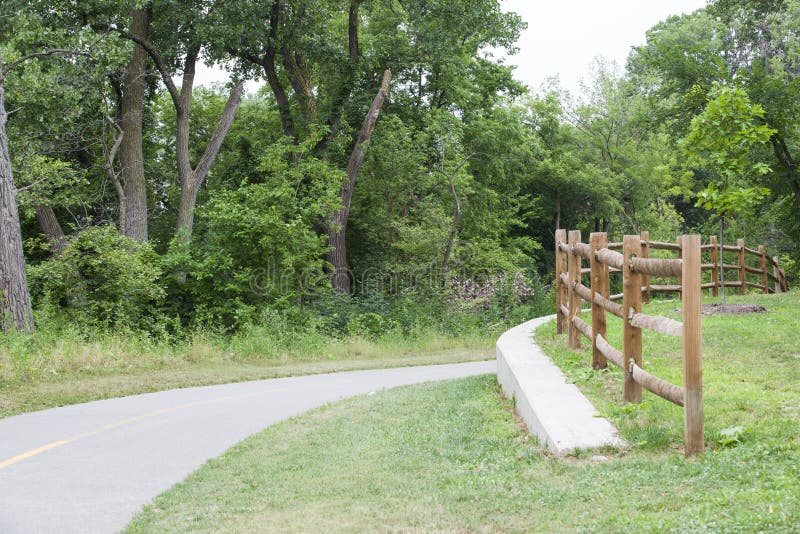 Wooden Fence Leading To a Forest Bike Path Stock Photo - Image of cook ...