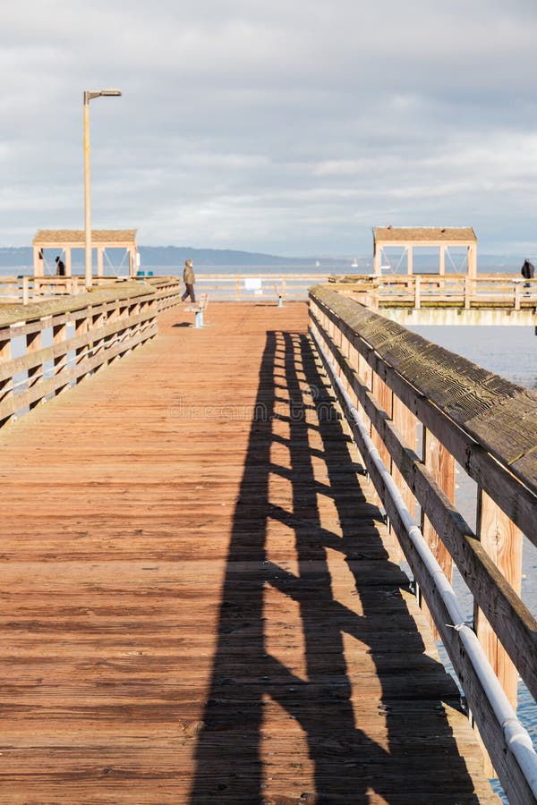 Wood Dock on Puget Sound on Sunny Day in Pacific Northwest Stock Image ...