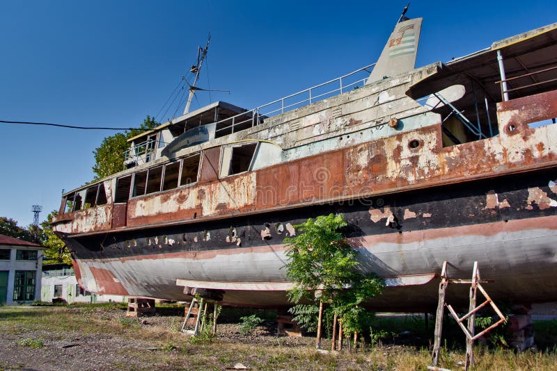 Rusty Abandoned Ship on the Beach in Sukhum, Abkhazia Stock Image ...