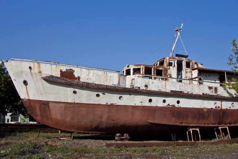 Rusty Abandoned Ship on the Beach in Sukhum, Abkhazia Stock Image ...