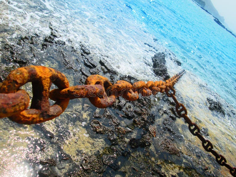 Anchor chain over the sea stock photo. Image of harbor - 117888044