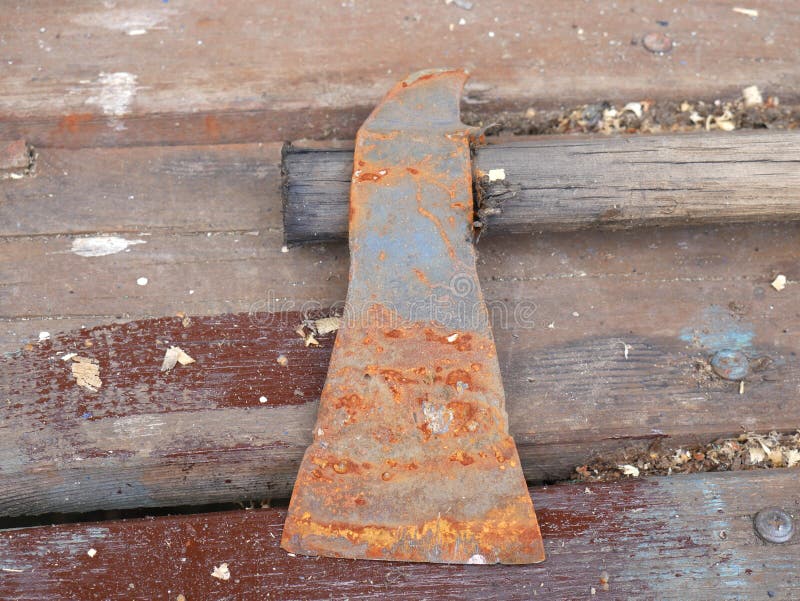 A Rusty Axe is Lying on the Table. the Blade is Clearly Visible Stock ...