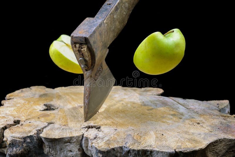 Rusty Axe Slicing an Apple in Half on the Wooden Board Stock Photo ...
