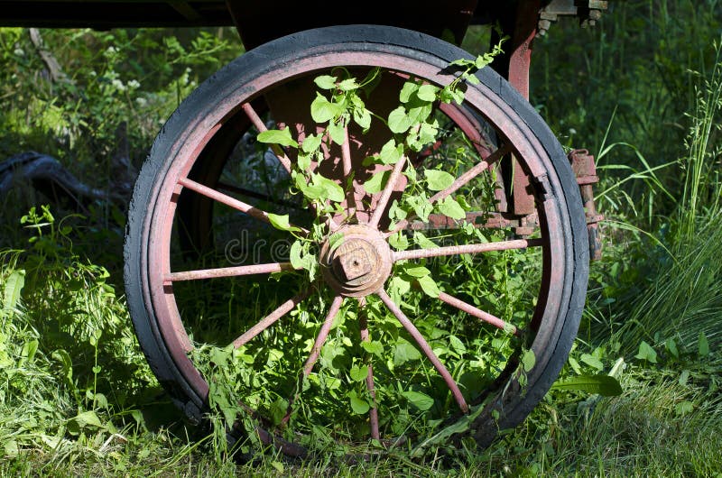 Rusty Ax;e Wheel stock image. Image of earth, green, grown - 99409695