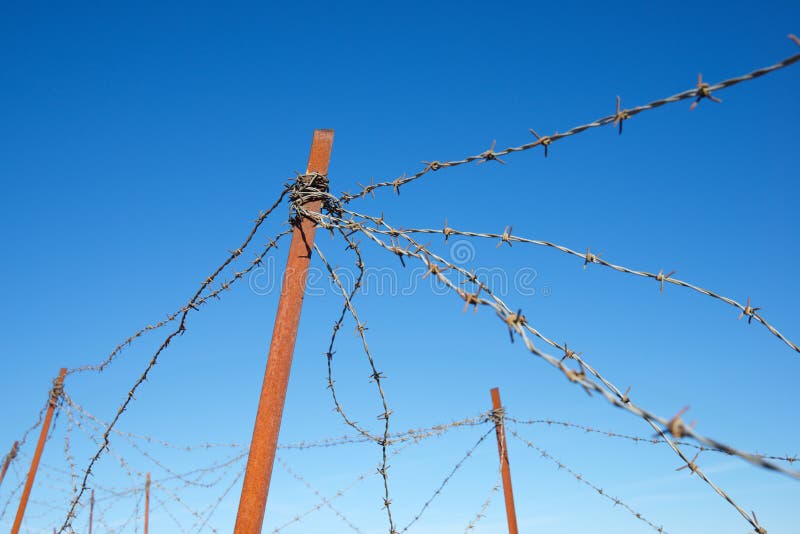 Rusty barbed wire fence stock photo. Image of protection - 203783614