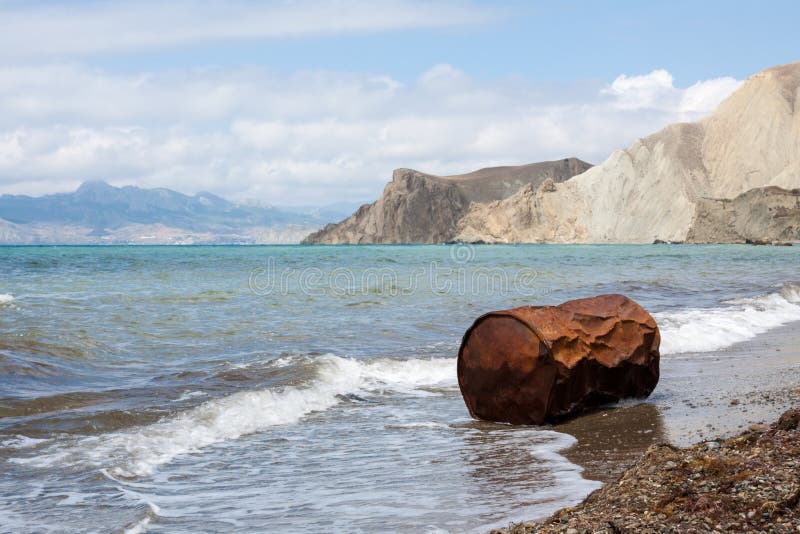 Rusty barrel on the coast stock image. Image of season - 135912611