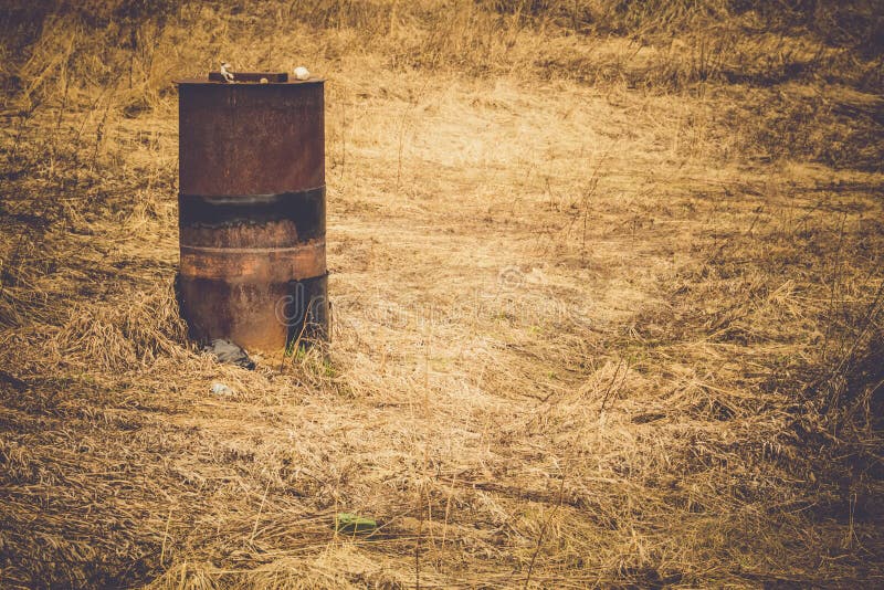 Rusty Barrel on Field stock image. Image of dump, economic - 97006237