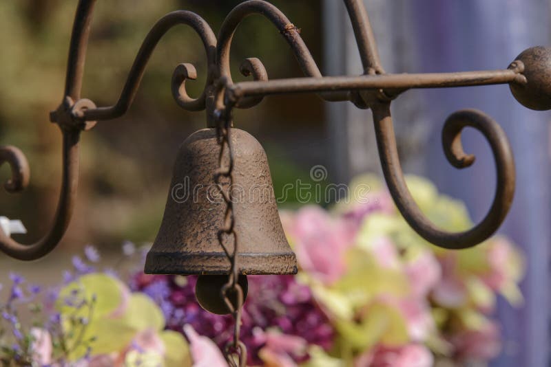 Rusty Bell in Retro Style Hangs on an Old Metal Holder. Stock Photo ...