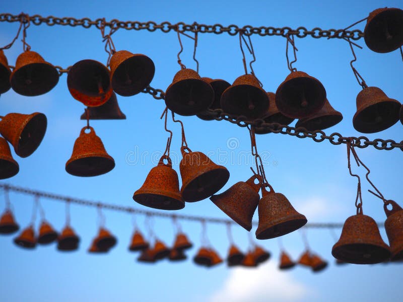 Rusty Bells Chain with Blue Sky Stock Image - Image of legend, copper ...