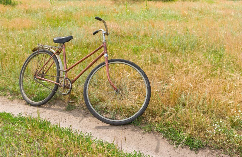 Rusty Bicycle Waiting for the Master on the Roadside Stock Photo ...