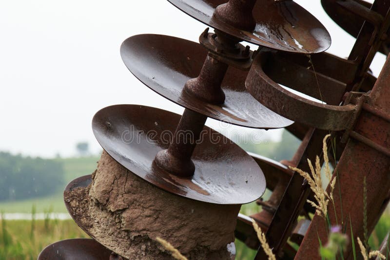 Rusty Blades of Farm Equipment in a Field Stock Photo - Image of ...