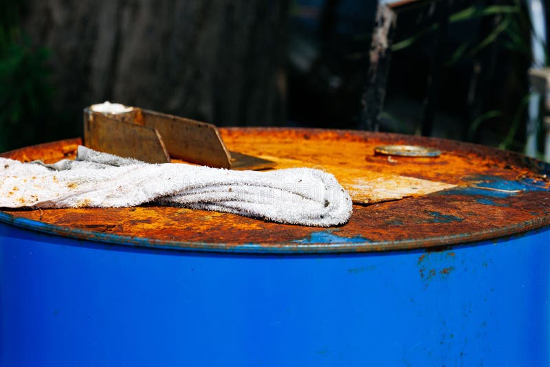 Rusty Blue Industrial Barrel with White Cloth Outdoors Stock Photo ...