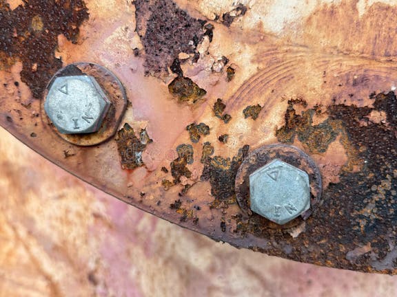 A Rusty Bolt with a Silver Head Sits on a Rusty Surface Stock Image ...