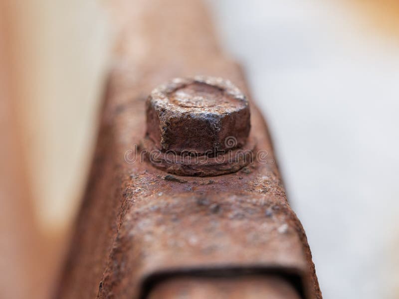 A Rusty Bolt is Sitting on a Rusted Surface. the Bolt is Surrounded by ...