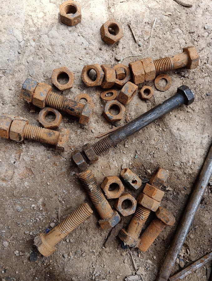 Rusty Bolts and Nuts: Forgotten Hardware in the Dust Stock Photo ...