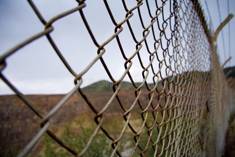 Rusty border fence stock image. Image of iron, barbed - 10923373