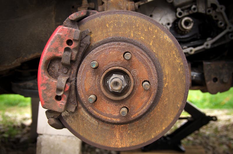 Rusty Brake Disc and Pad on a Broken Car in the Yard Stock Photo ...