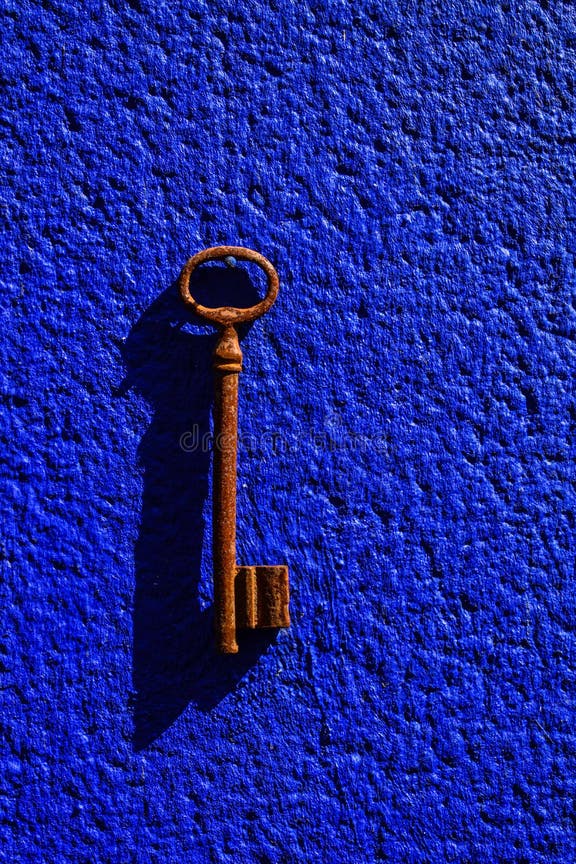 Rusty Brass Key on the Blue Wall Stock Photo - Image of lock, brown ...