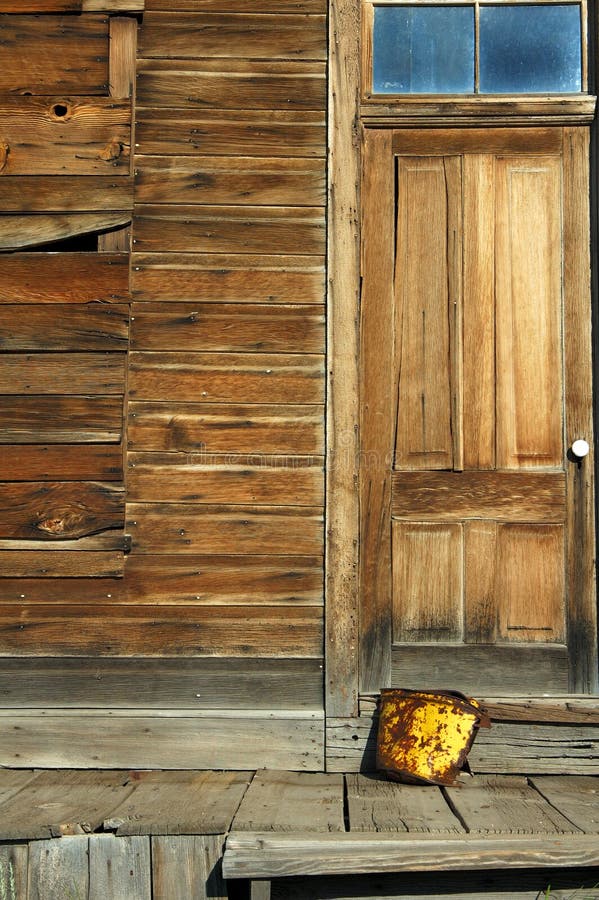 Rusty Bucket & Ghost Town Door Stock Image - Image of antique, glass ...