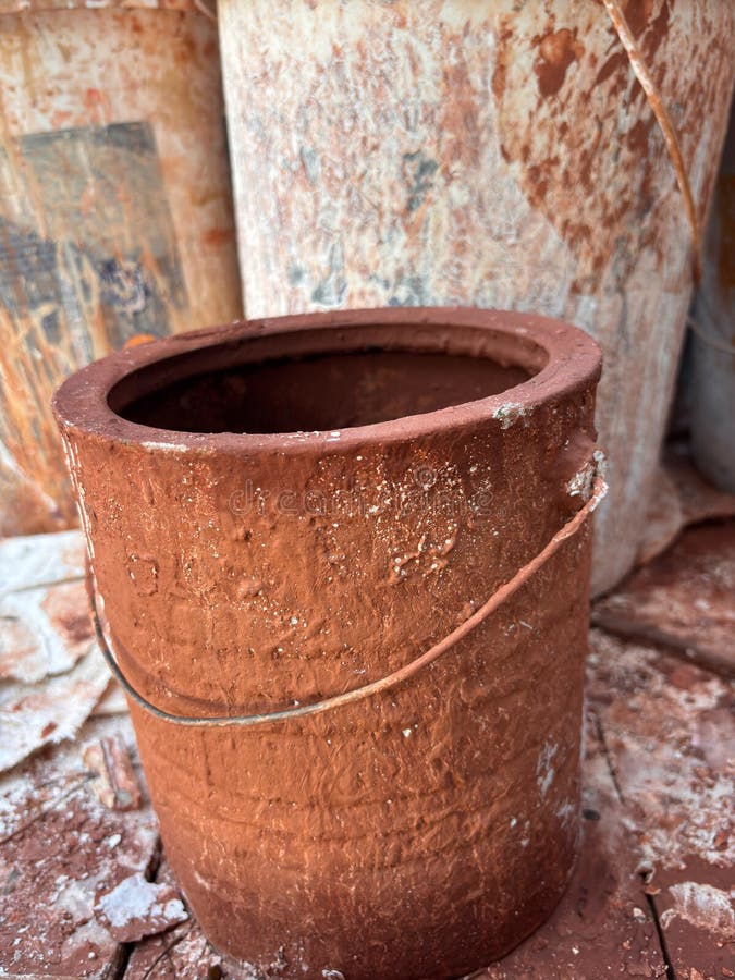 A Rusty Bucket with a Handle Sits on a Brick Wall Stock Photo - Image ...