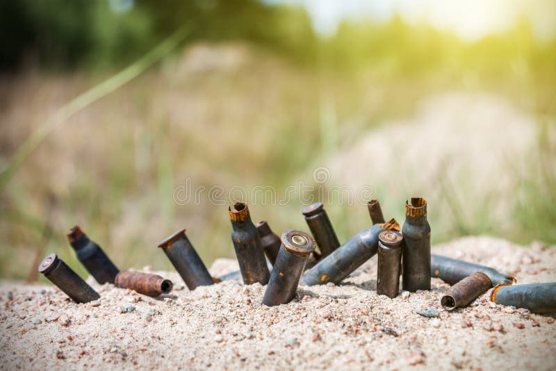 Rusty Bullet Shells on the Battlefield Stock Photo - Image of weapon ...