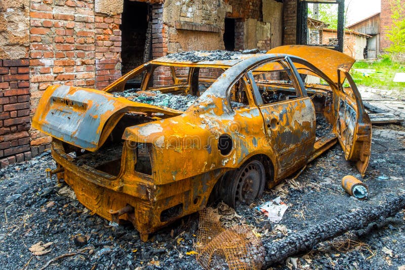Rusty and burnt car wreck stock photo. Image of plant - 54708998