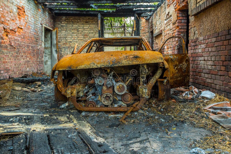 Rusty and burnt car wreck stock image. Image of wall - 54709055