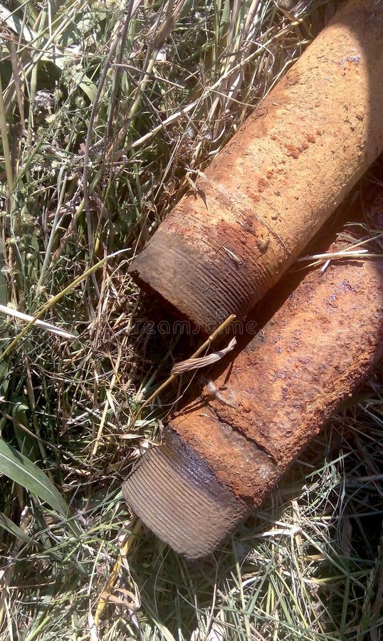 2 Unusable Rusty Pipes Left in the Ground Stock Photo - Image of ...