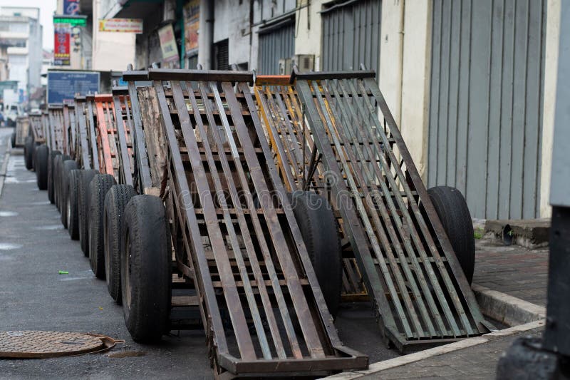 Rusty Cargo Carriers Parked on a City Street Stock Photo - Image of ...