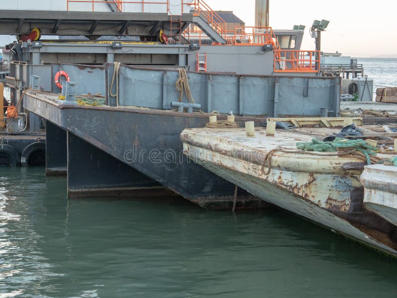 Rusty Cargo Ships and Boats among Equipment Sitting at Industrial Dock ...
