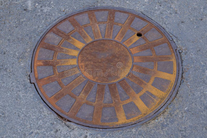 Rusty Cast Iron Manhole Cover Close-up. Stock Image - Image of rusty ...