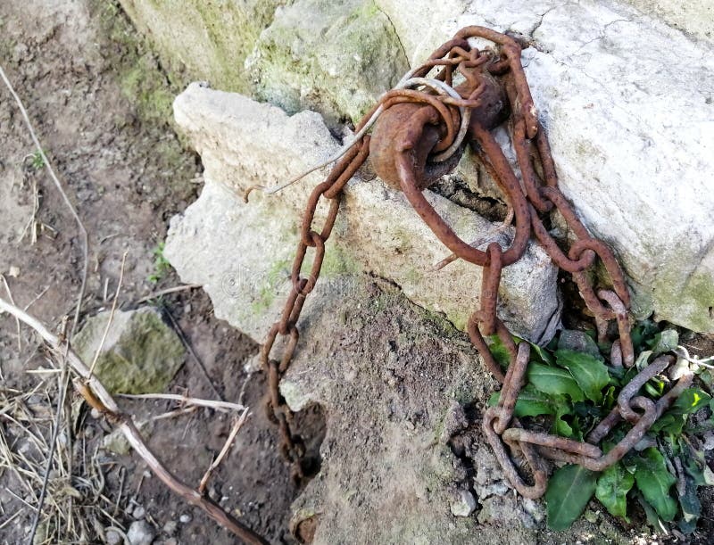 A Rusty Chain is Attached To a Pin in the Wall. Deprivation of Rights ...