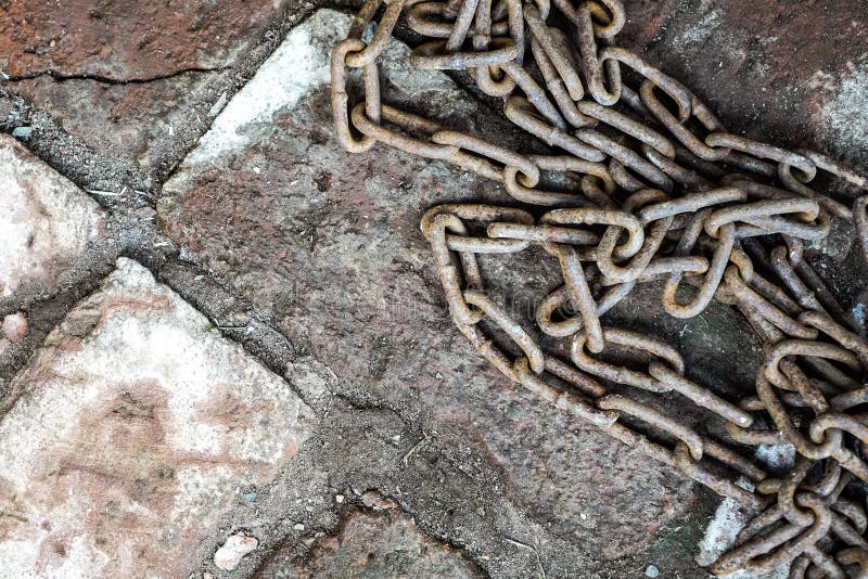 Rusty Chain on the Brickwork. the Symbol of Slave Labor Stock Photo ...
