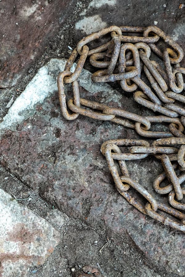 Rusty Chain on the Brickwork. the Symbol of Slave Labor Stock Image ...