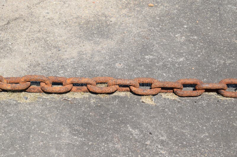 Rusty Chain on Concrete Ground Stock Photo - Image of animal, weathered ...