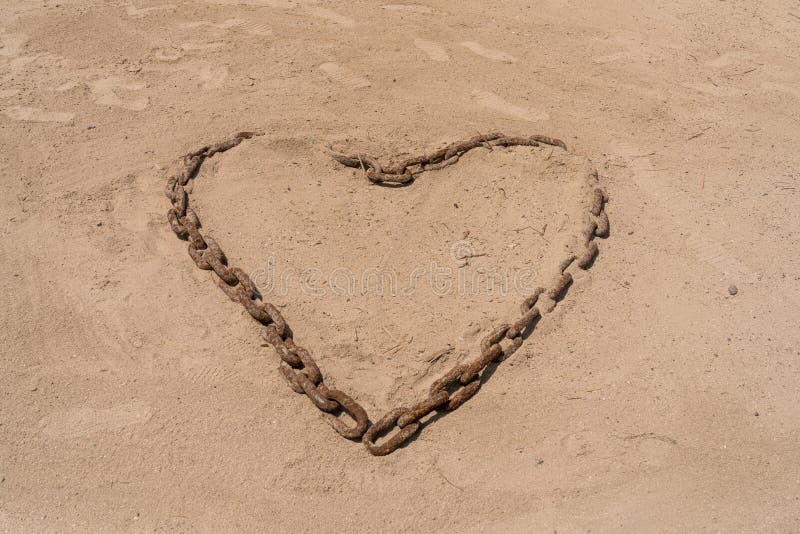Rusty Chain Formed in Shape of a Heart on a Sandy Beach Stock Photo ...