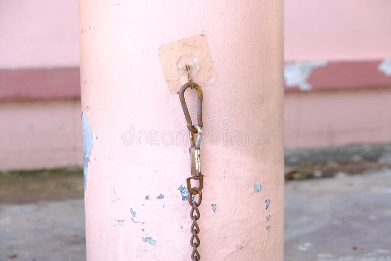 A Rusty Chain Hang on an Old Pillar with Plastic Hanger. Stock Image ...