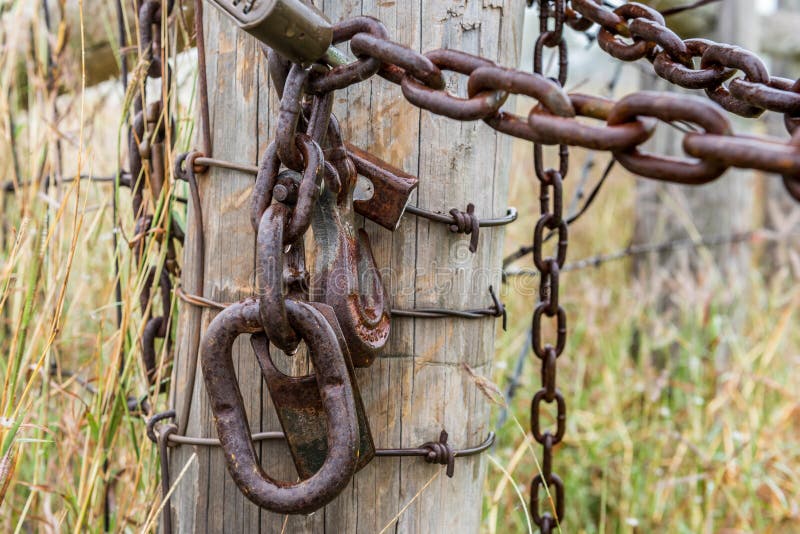 Rusty Chain and Lock on Fense Post Stock Photo - Image of links, farm ...